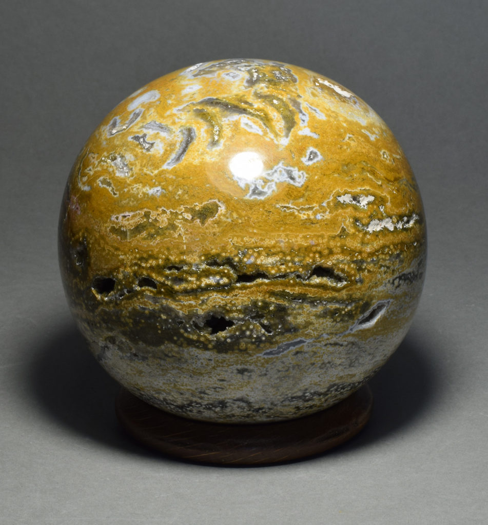 9 cm Polished ocean jasper sphere with outstanding gold color